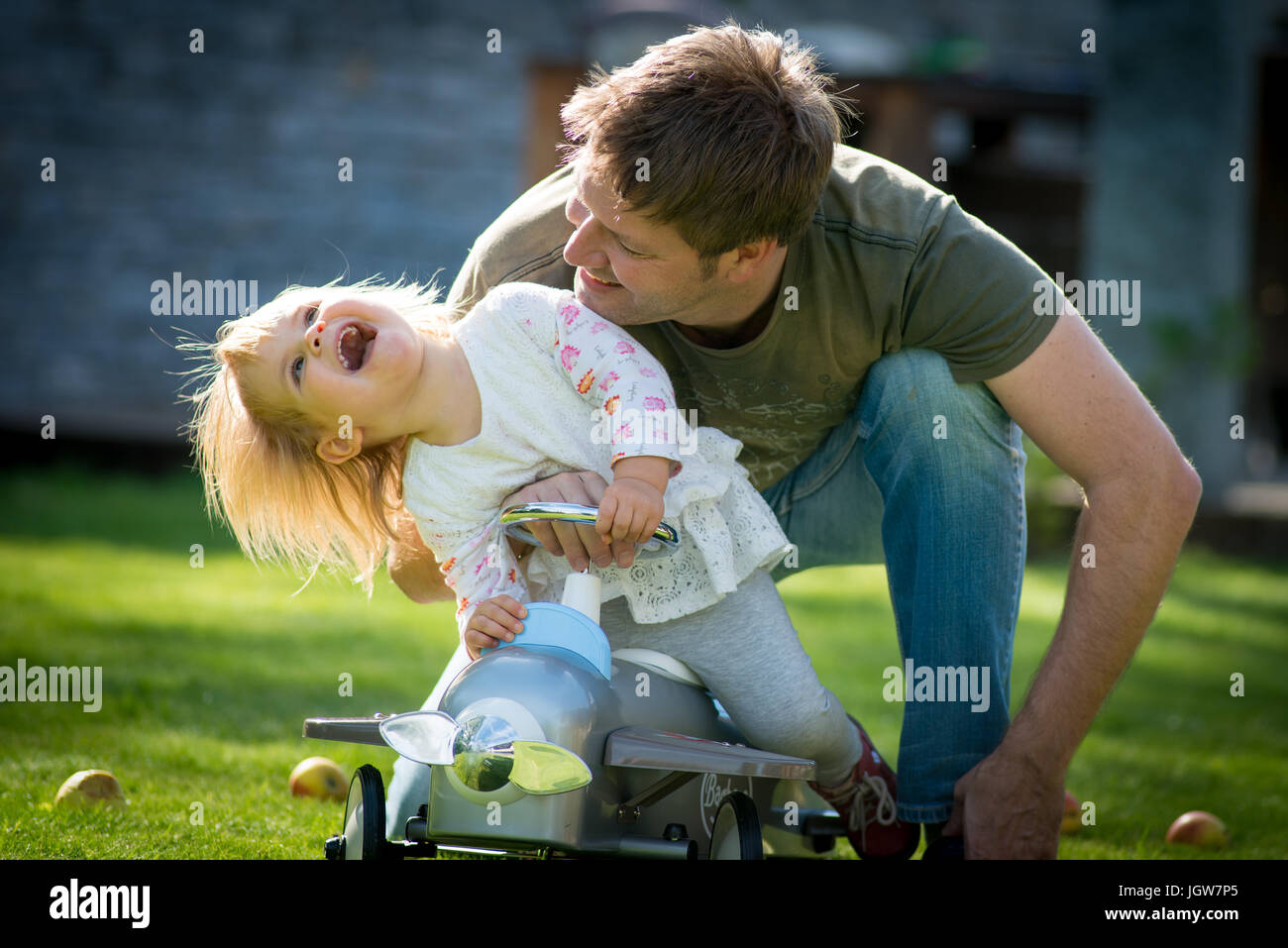 father playing with his child girl and having fun together Stock Photo ...