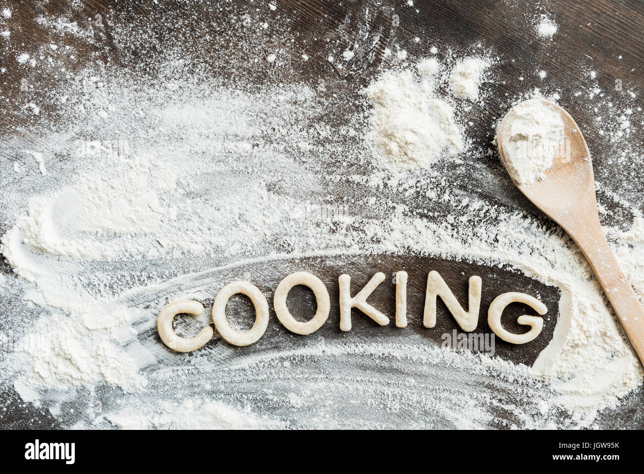 Top view of edible word cooking made from sweet crunchy cookies, baking ...