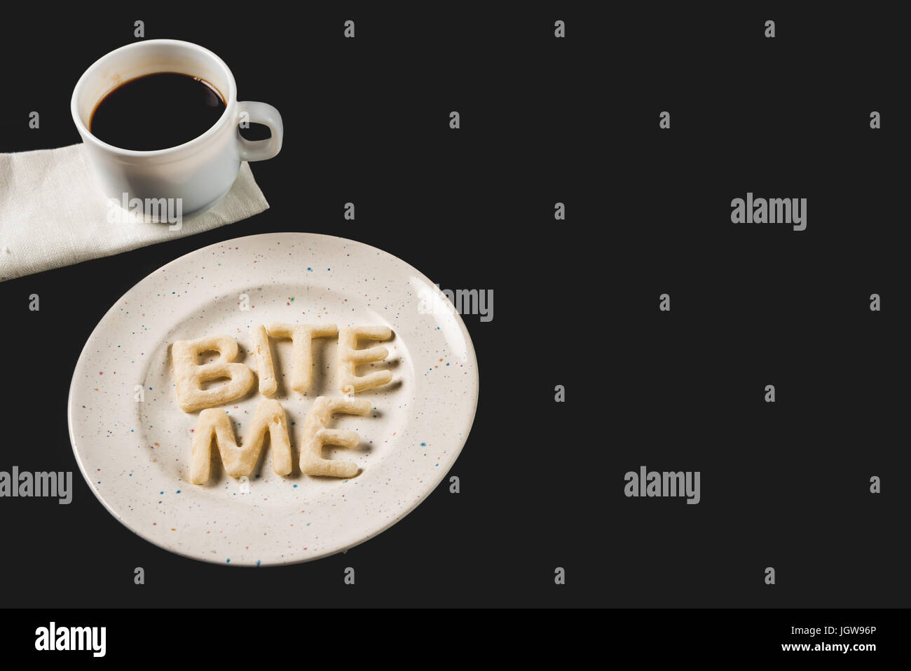 side view of lettering bite me made from cookie dough on plate with ...