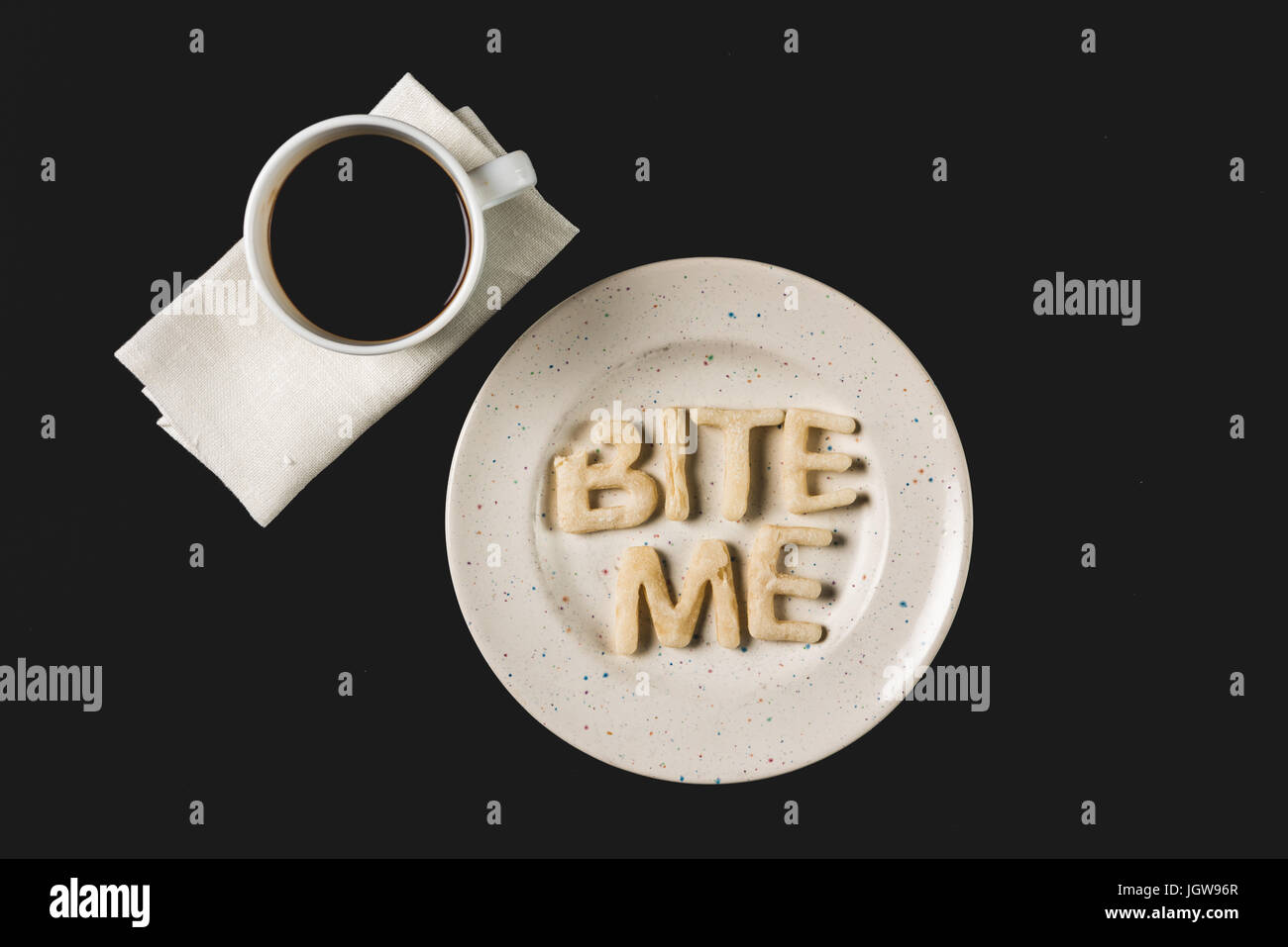 top view of lettering bite me made from cookie dough on plate with ...