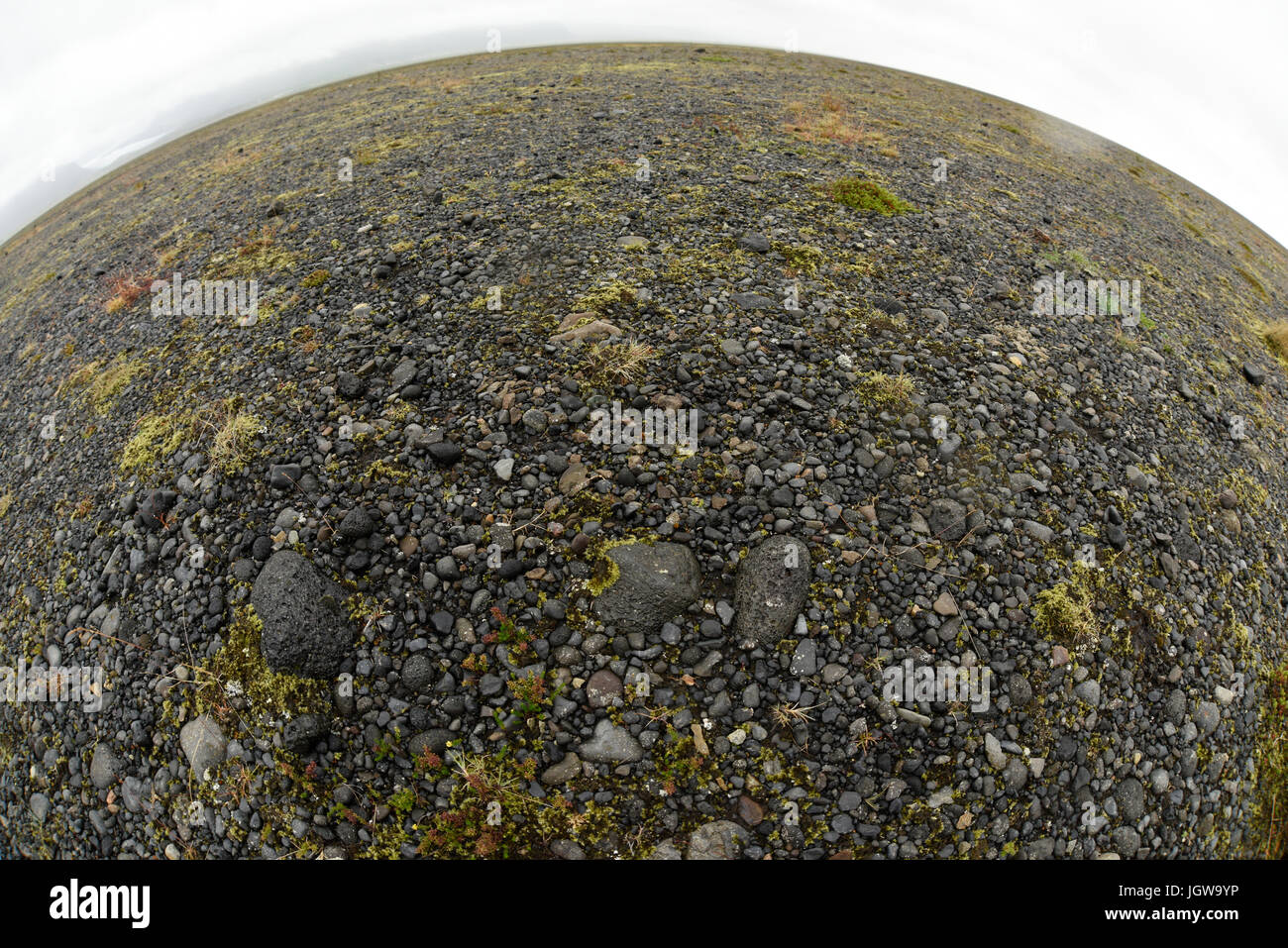 Volcanic rock on a rounded horizon Stock Photo - Alamy