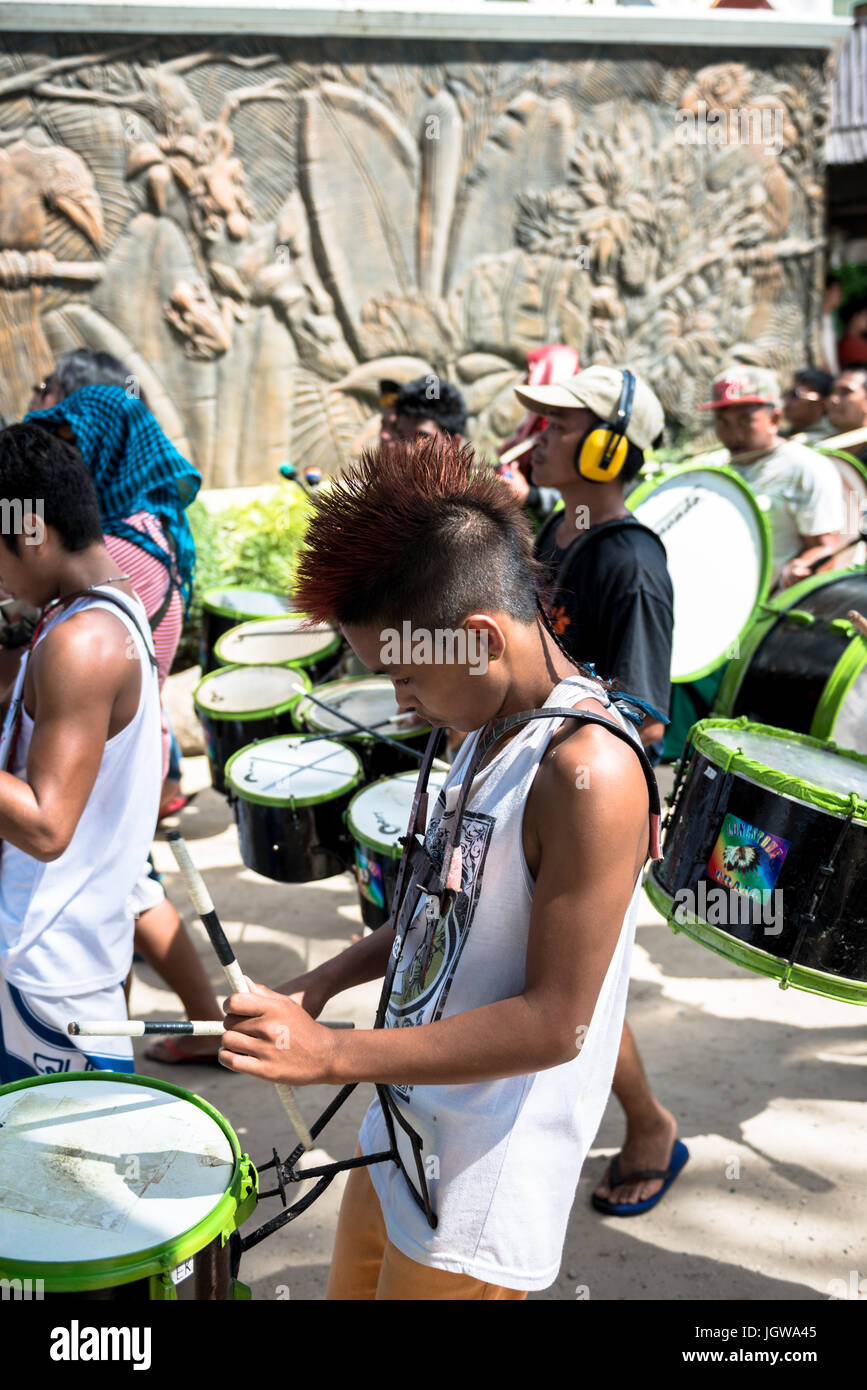 Men playing drums for the band during Ati-Atihan Festival at White ...