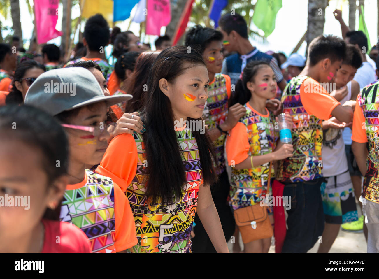 Groups of filipinos with face painted and orange shirts during Ati ...