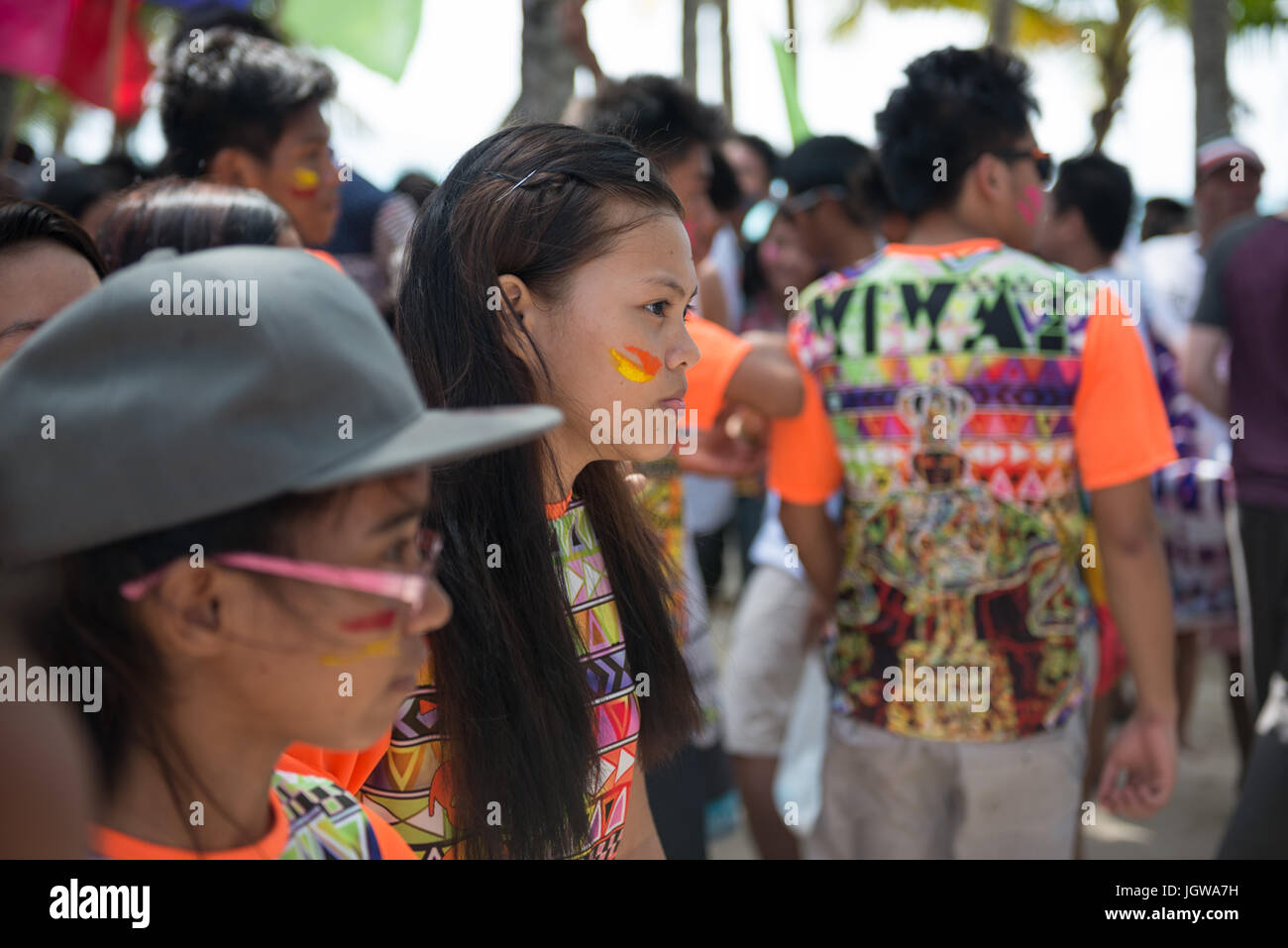 Filipino girl with face painted looking the celebration of Ati-Atihan ...
