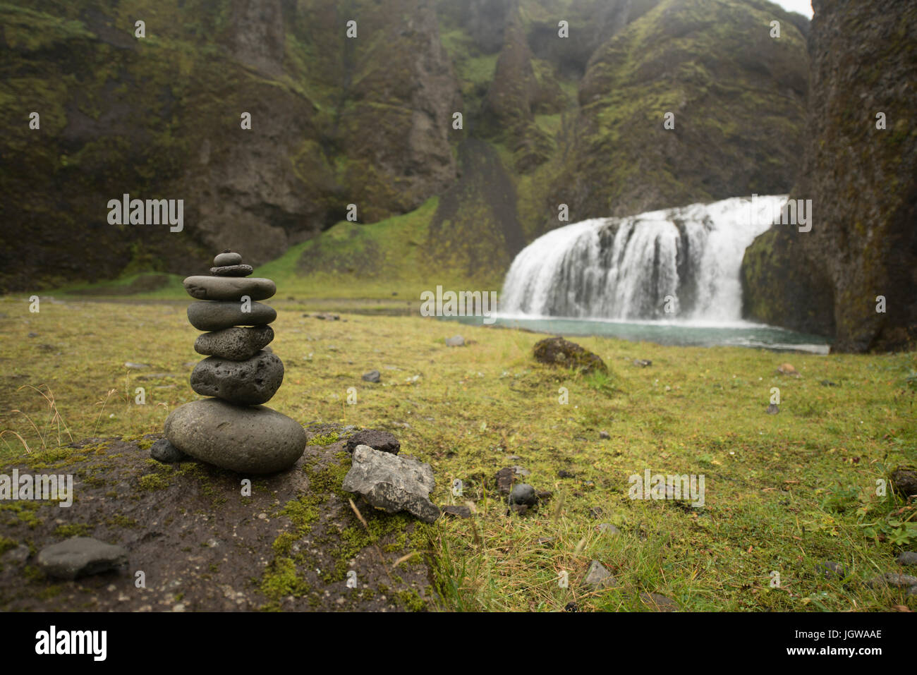 Stack of pebbles and waterfall Stock Photo - Alamy
