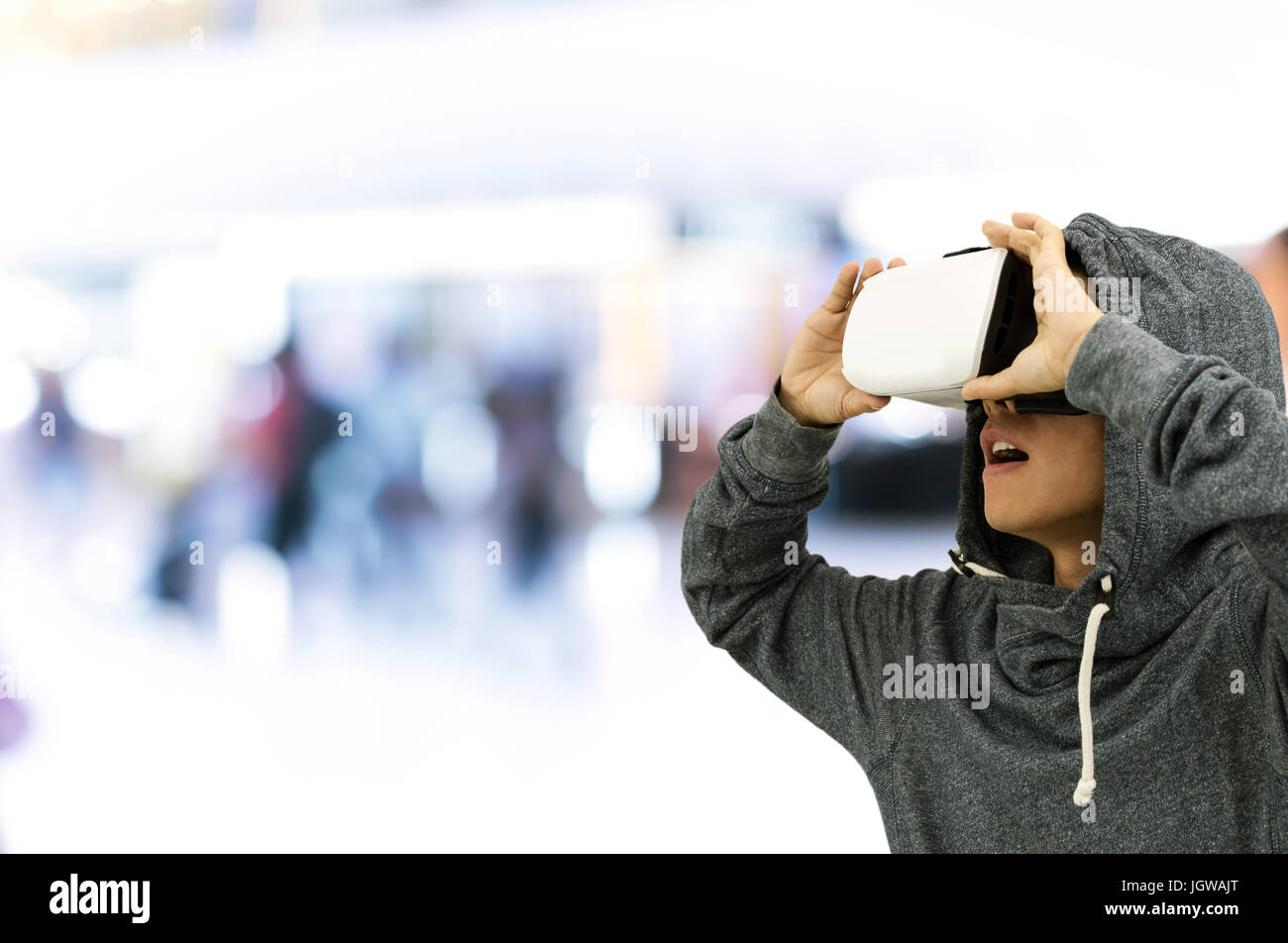 isolated man using VR glasses on on shopping mall background Stock ...