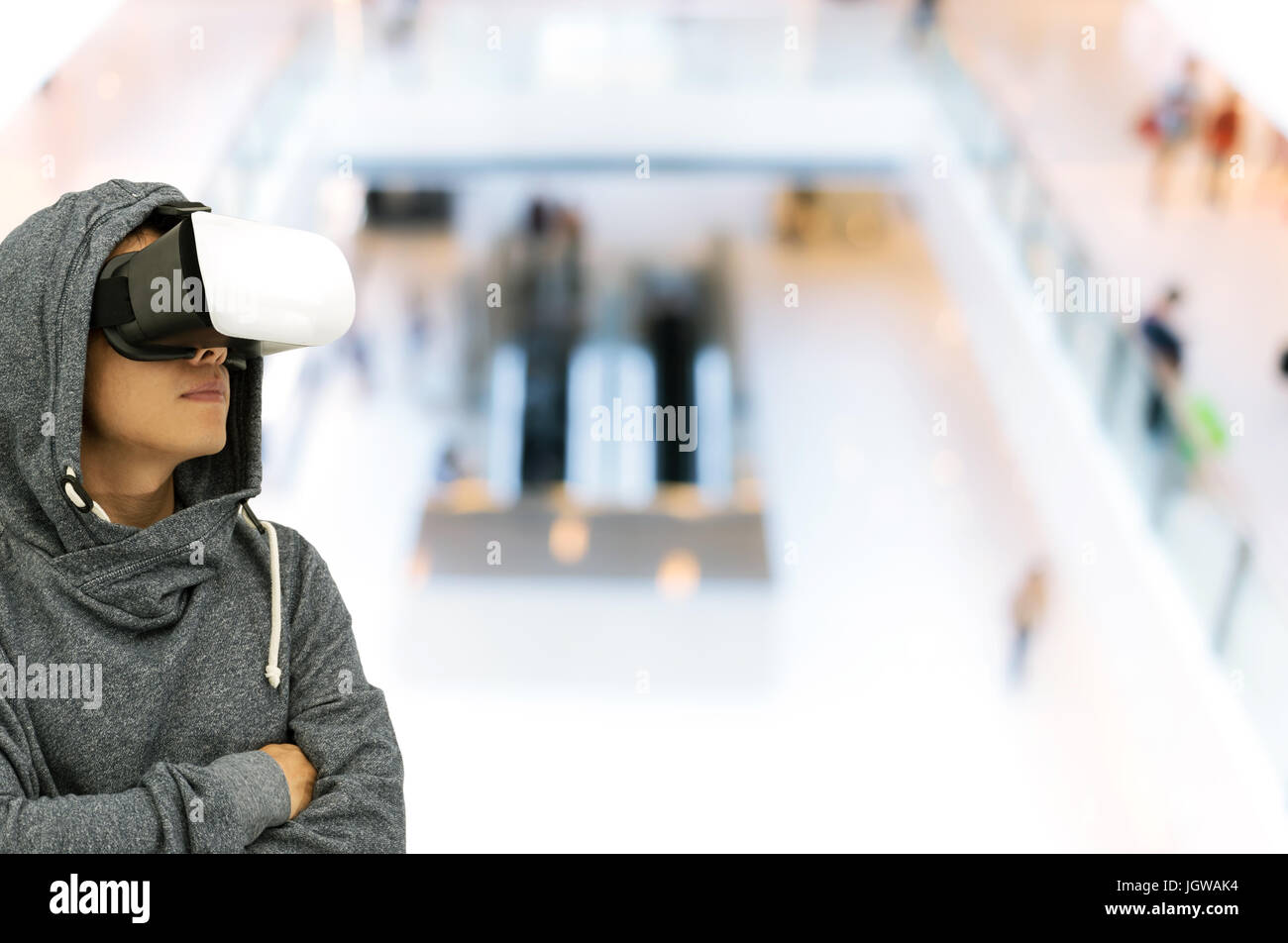 isolated man using VR glasses on on shopping mall background Stock ...