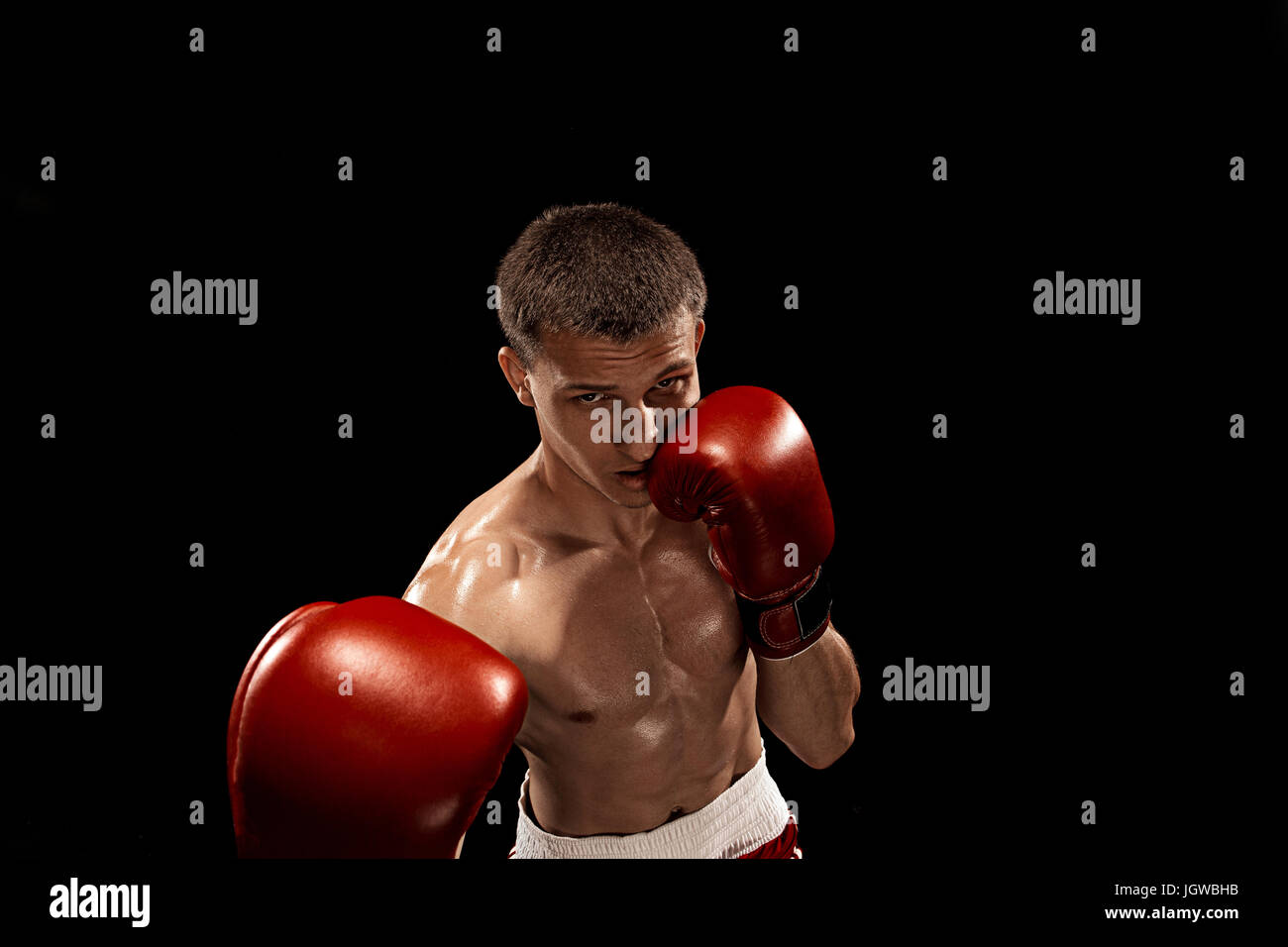 Male boxer boxing with dramatic edgy lighting in a dark studio Stock ...