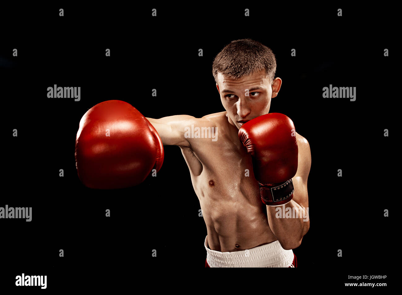 Male boxer boxing with dramatic edgy lighting in a dark studio Stock ...
