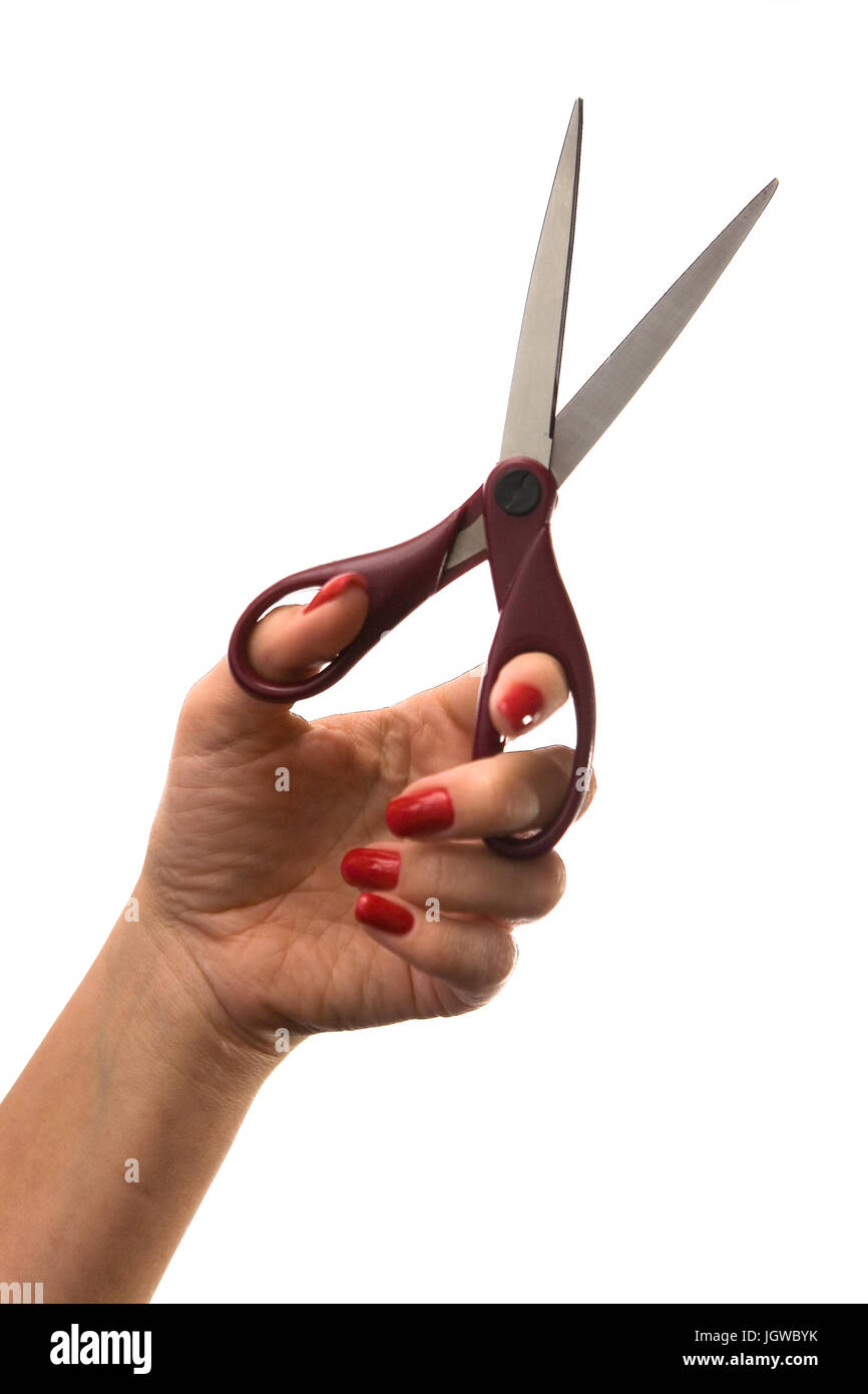 Scissors in a beautiful elegant female hand on a white background Stock ...