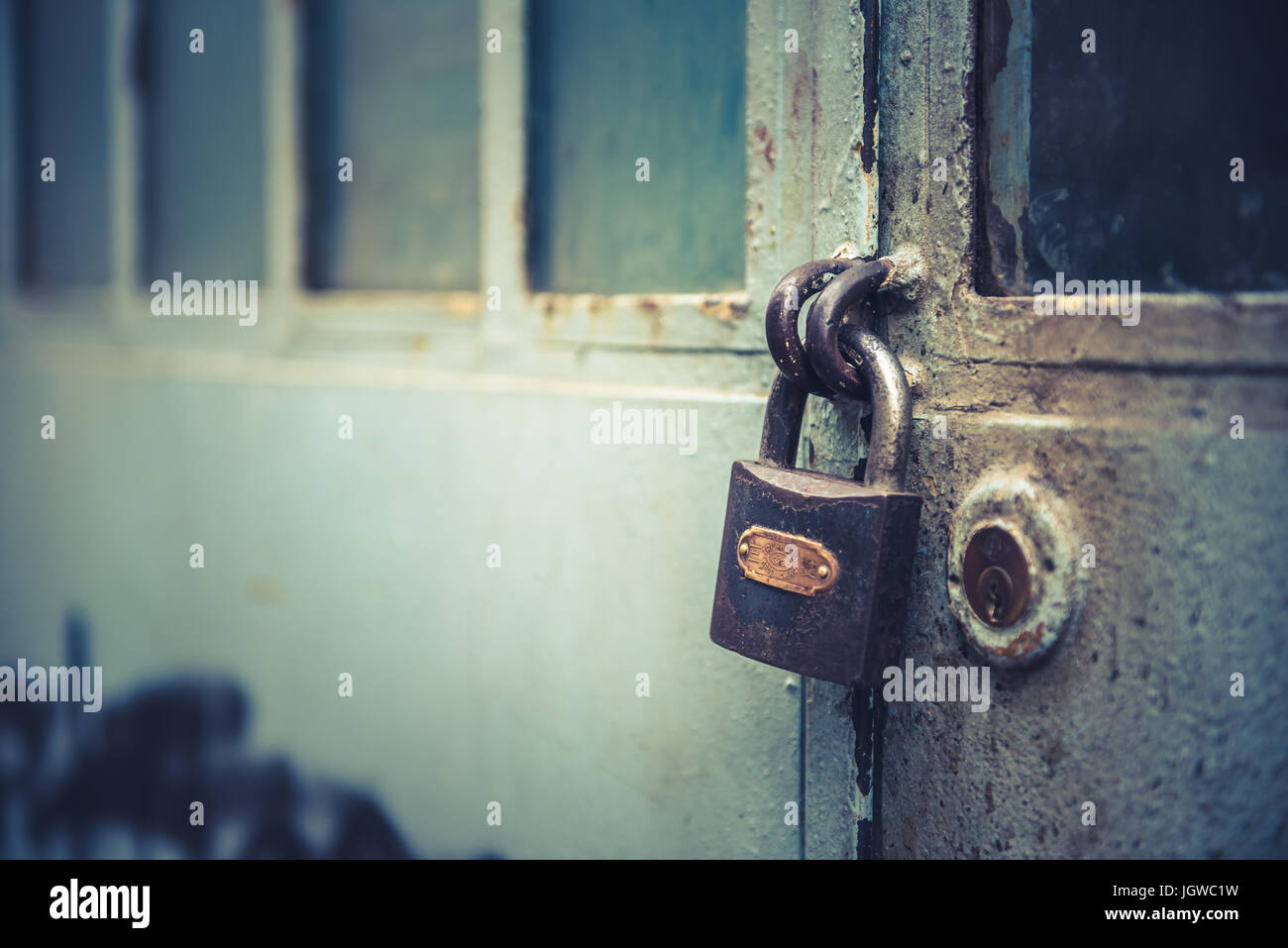 Architectural detail of a vintage, rustic metal door and lock Stock ...