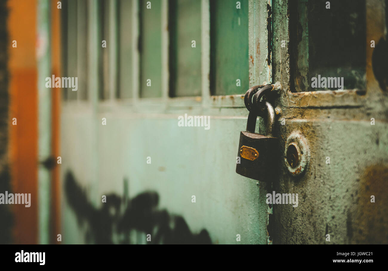 Architectural detail of a vintage, rustic metal door and lock Stock ...