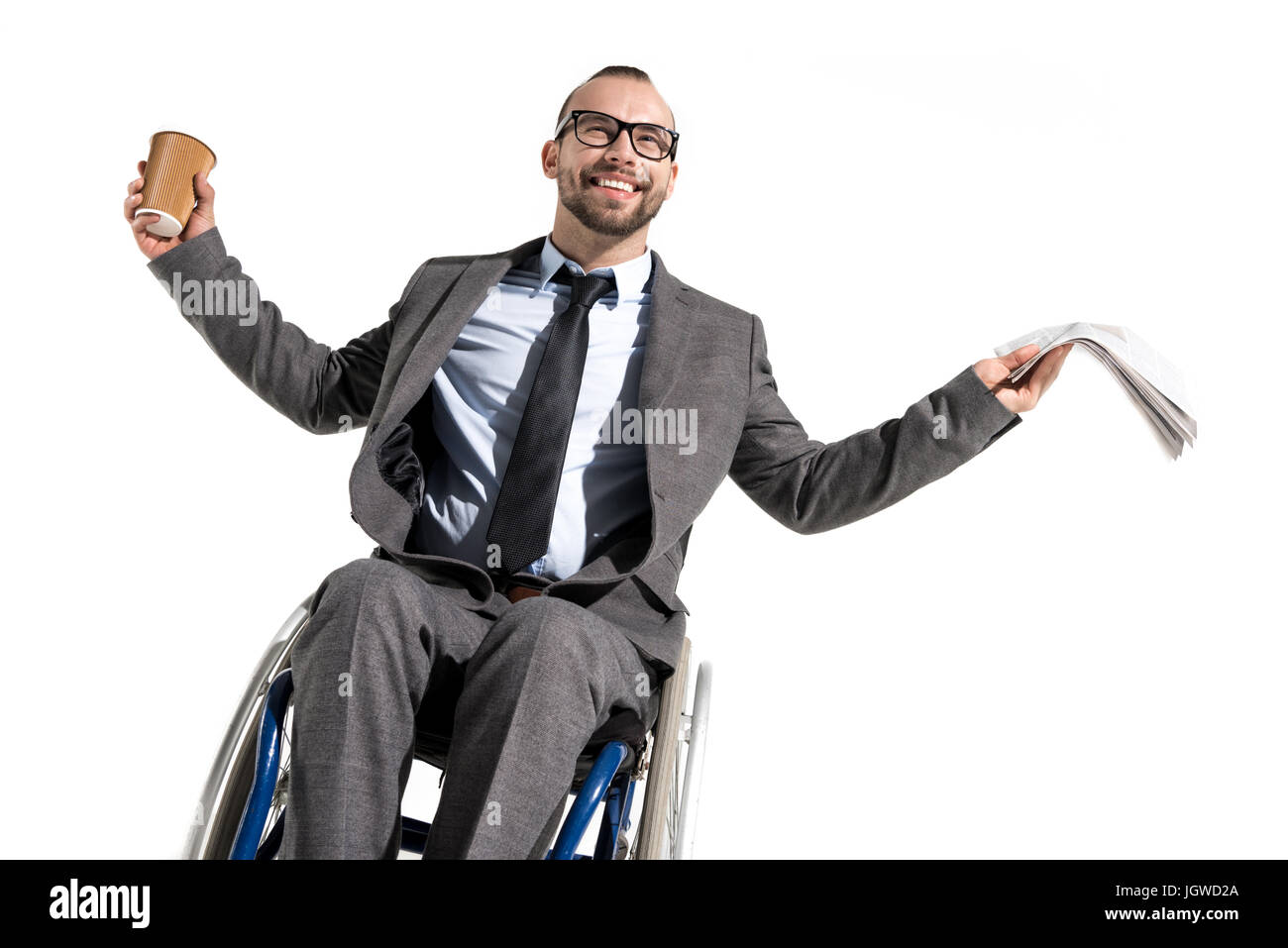 disabled businessman in wheelchair holding coffee and newspaper ...
