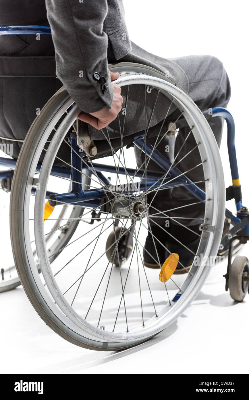 cropped shot of physically handicapped man on wheelchair isolated on ...