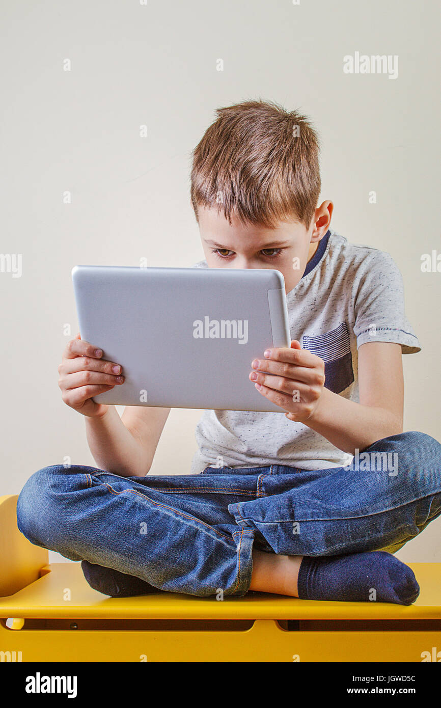 Little boy with tablet computer Stock Photo - Alamy