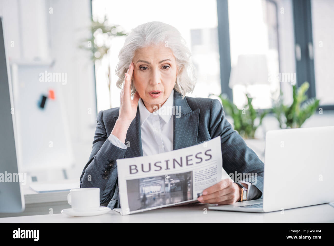 Office lady reading newspaper hi-res stock photography and images - Alamy