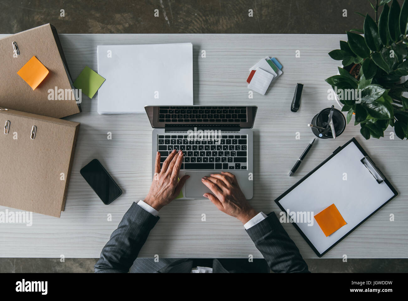 top view of senior businesswoman working with laptop computer on ...