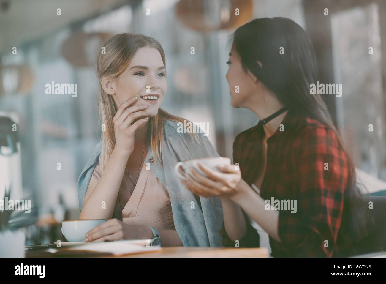 young attractive multicultural women on coffee break in cafe Stock ...