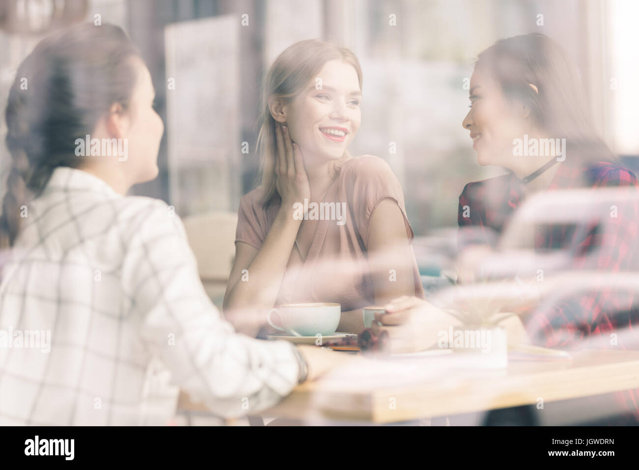 friends spend time together on coffee break in cafe Stock Photo - Alamy