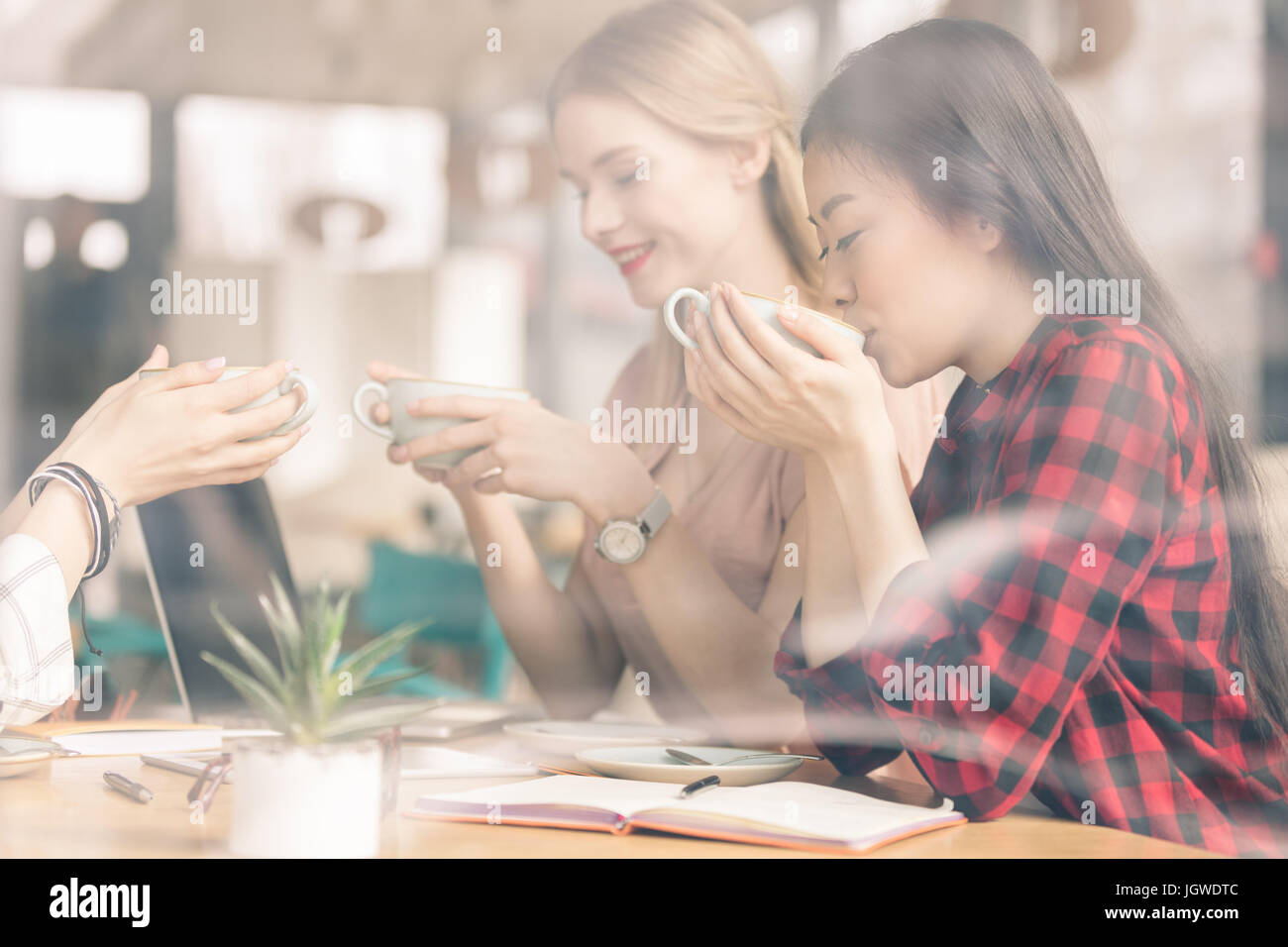 friends spend time together on coffee break in cafe Stock Photo - Alamy
