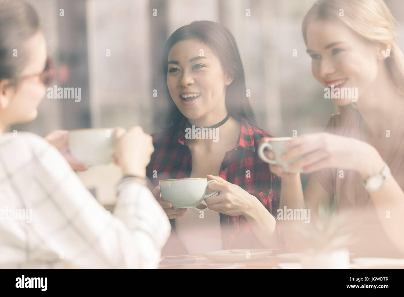 friends spend time together on coffee break in cafe Stock Photo - Alamy