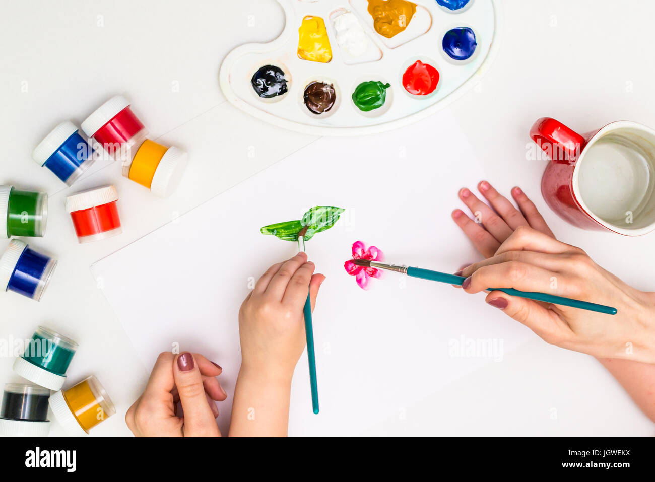Child painting a flower Stock Photo - Alamy