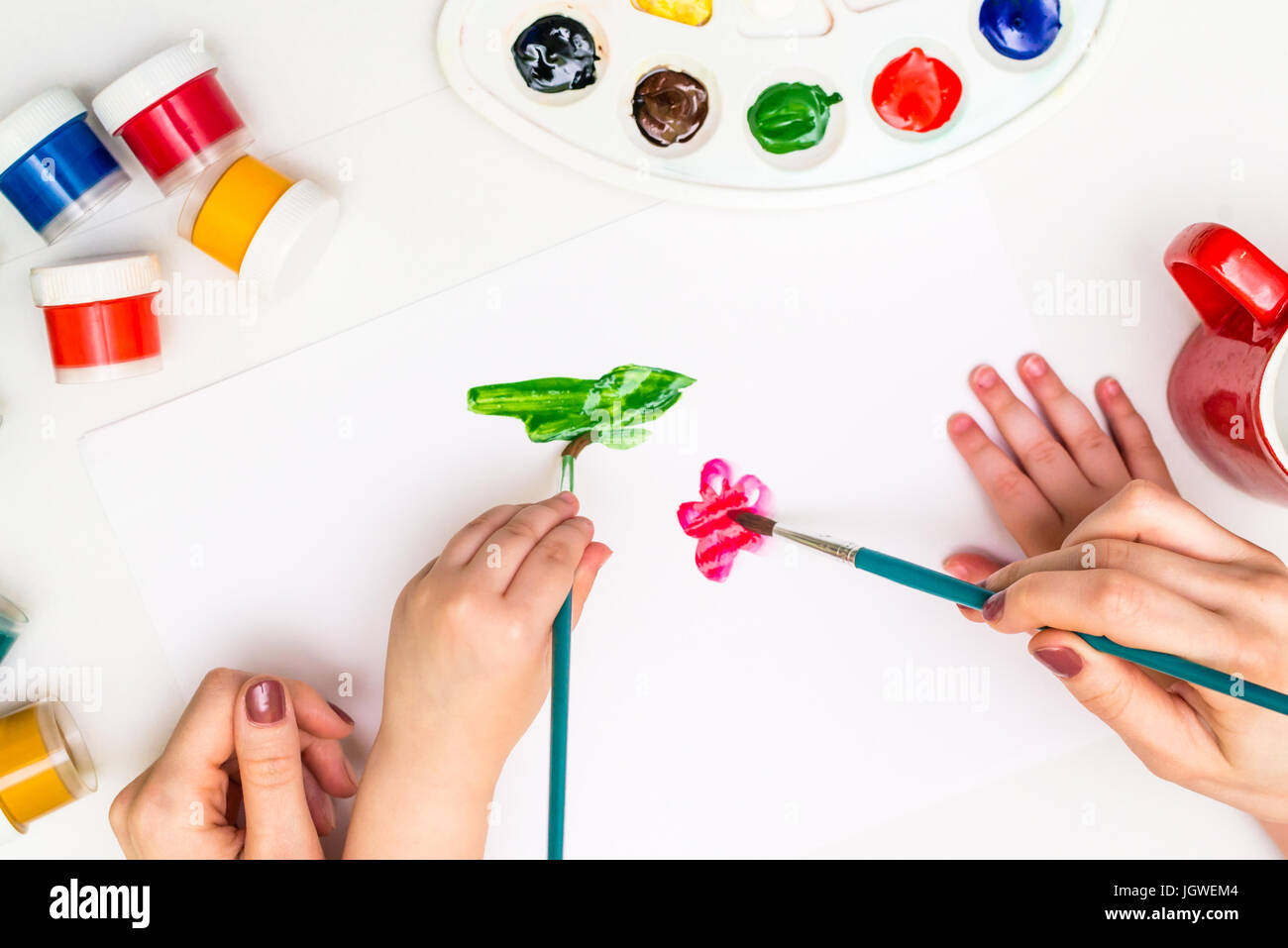 Child painting a flower Stock Photo - Alamy