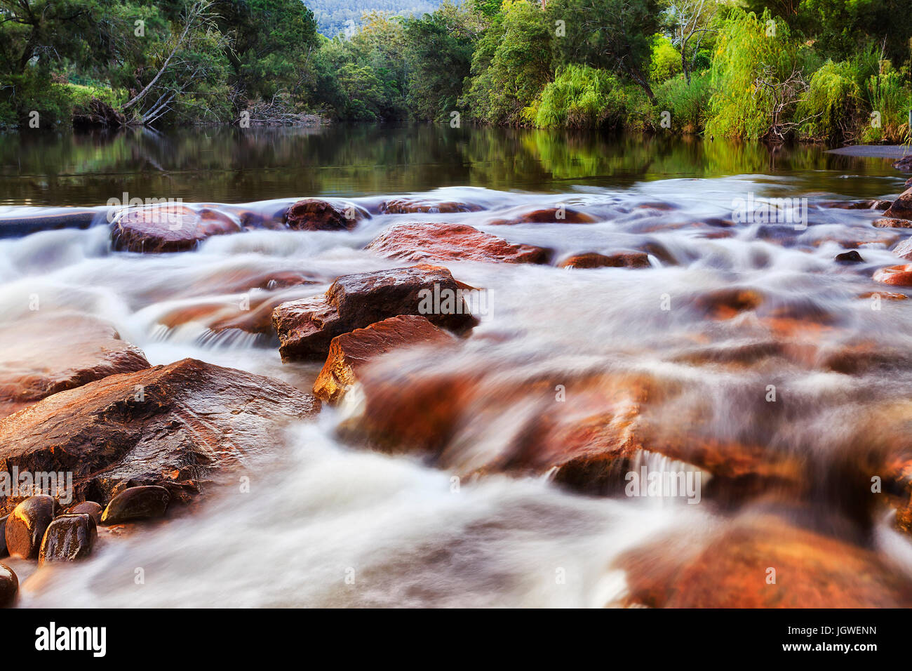 Stone riffles on rapid mountain Gloucester river below still waters ...