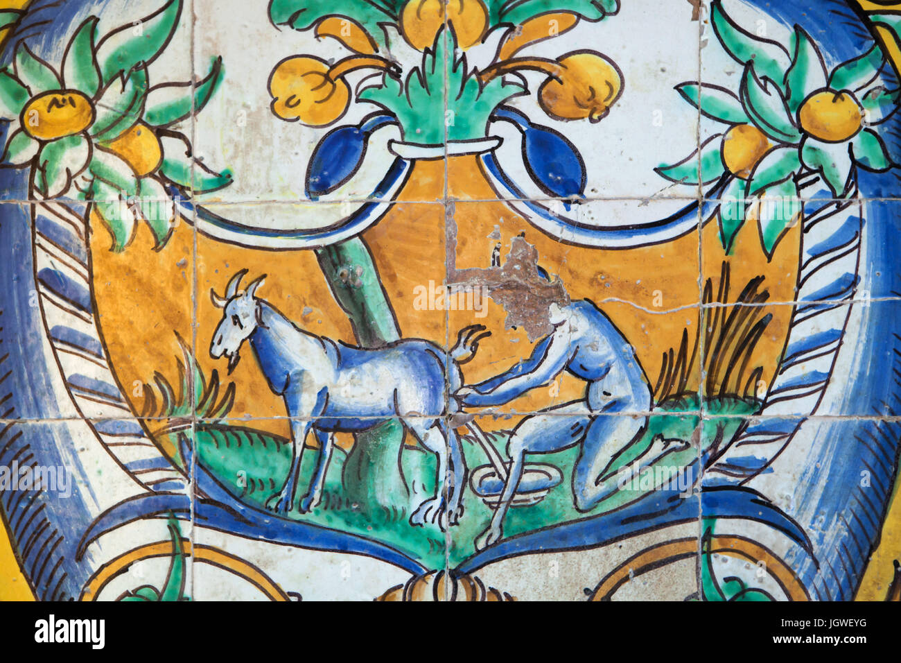 Man milking the she-goat depicted in the Renaissance polychrome painted ...