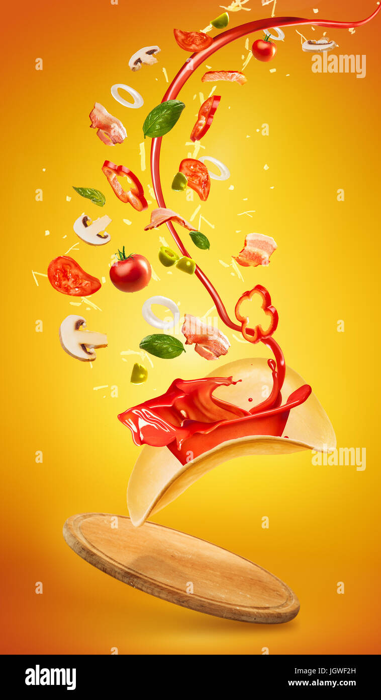 Tasty pizza and falling ingredients on orange background. Collage Stock ...