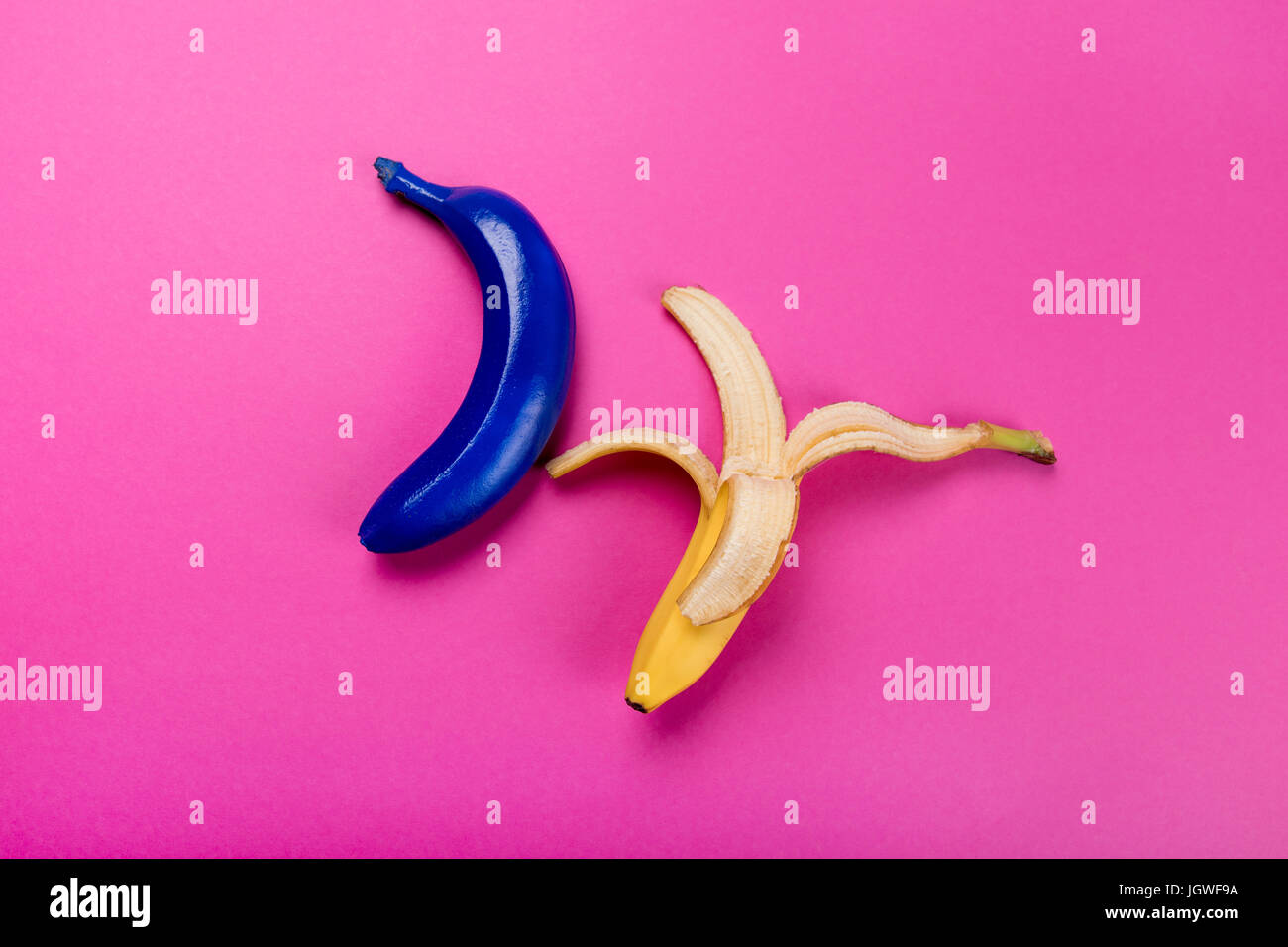Top view of blue and yellow bananas isolated on pink, ripe bananas ...