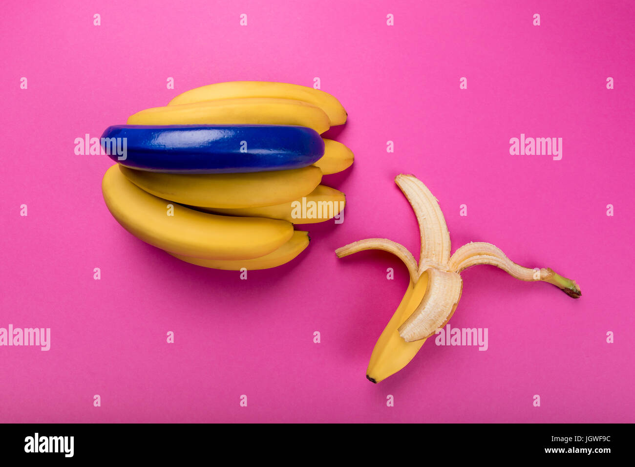 Top view of blue and yellow bananas isolated on pink, ripe bananas ...