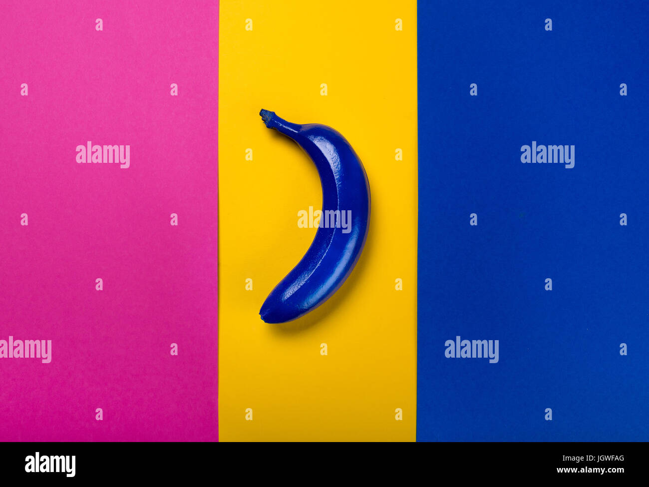 Top view of one whole blue colored banana on colorful background Stock ...