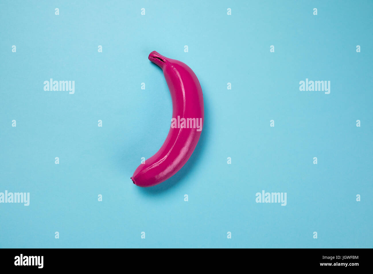 Top view of one whole pink colored banana isolated on blue Stock Photo ...