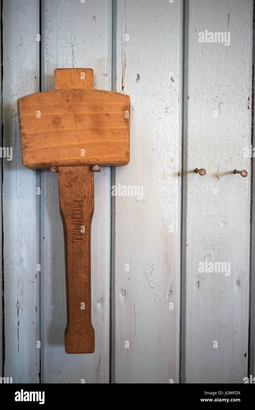 Wooden mallett hanging on workshop wall Stock Photo - Alamy