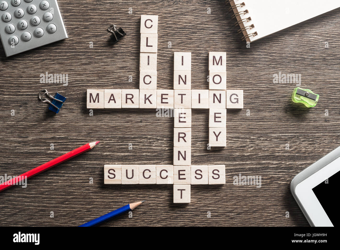 Conceptual business keywords on table with elements of game making ...