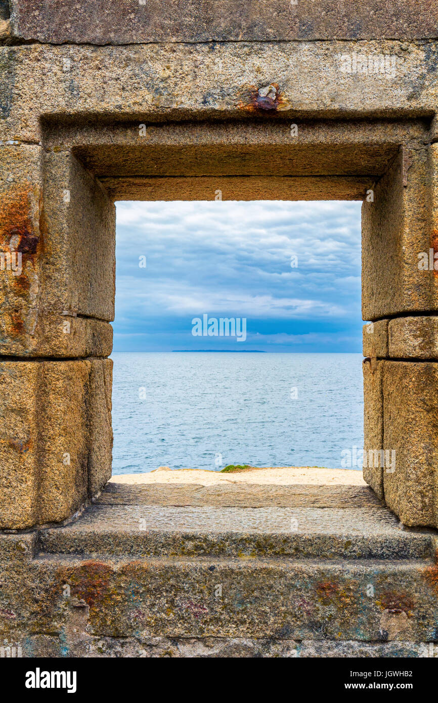 Ocean viewed through window of stone wall Stock Photo - Alamy