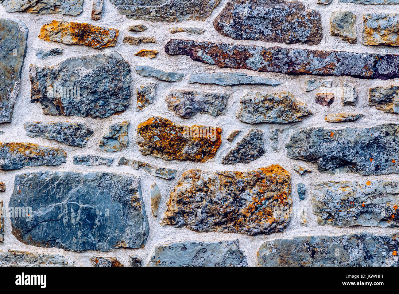 Background of old stacked stone wall Stock Photo - Alamy