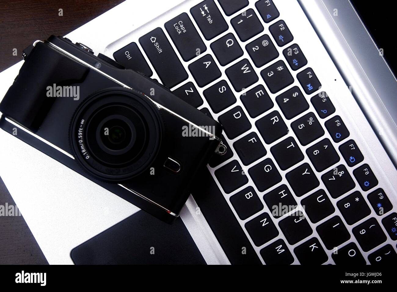 Photo of a camera on a laptop computer keyboard Stock Photo - Alamy