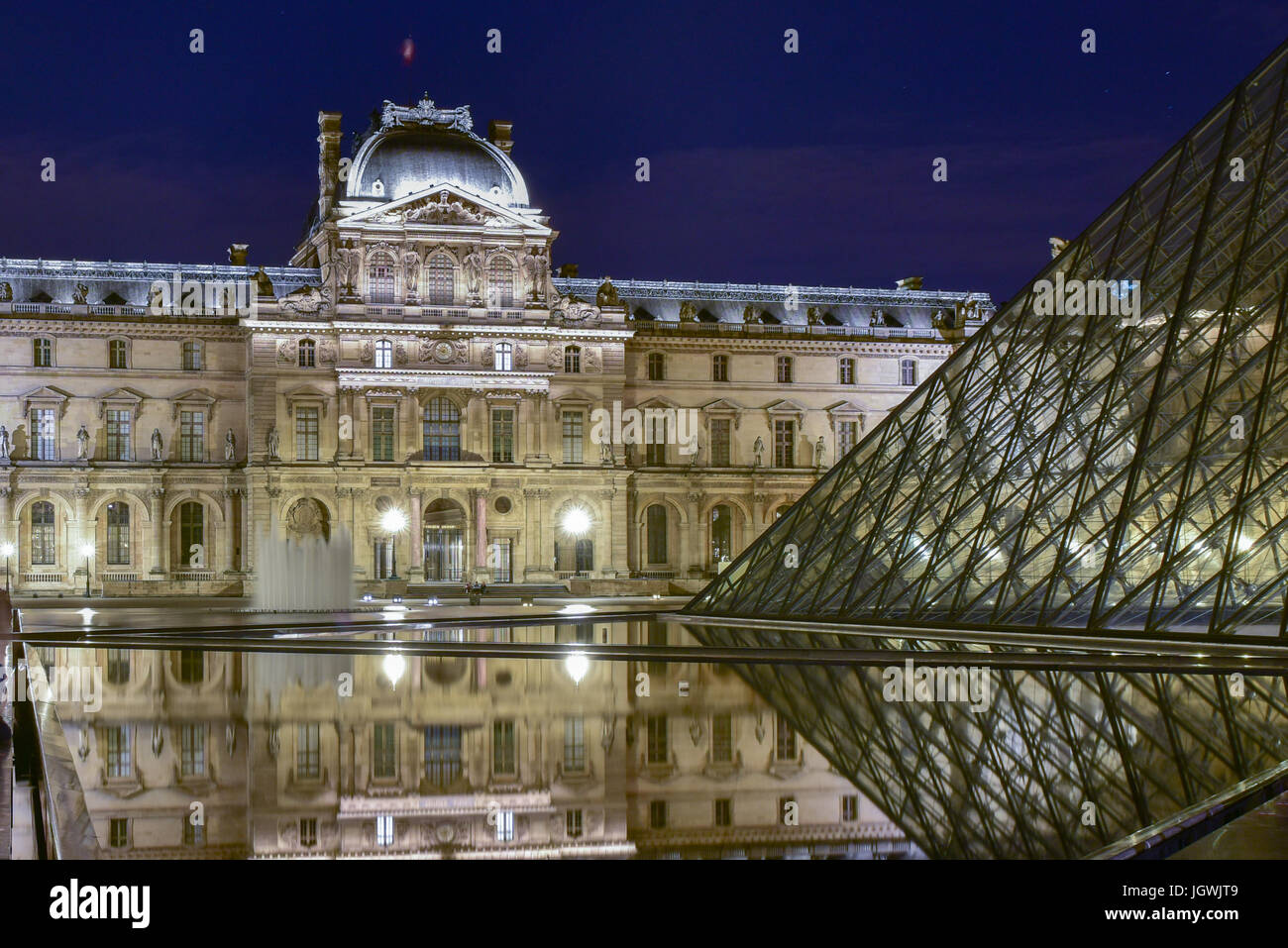 Louvre Museum at night in Paris, France Stock Photo - Alamy