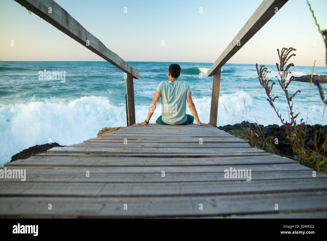 Sitting on a wooden bridge hi-res stock photography and images - Alamy