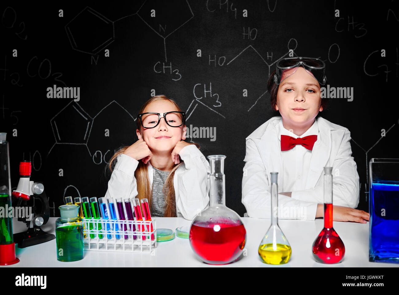 Two chemists thinking about something Stock Photo - Alamy