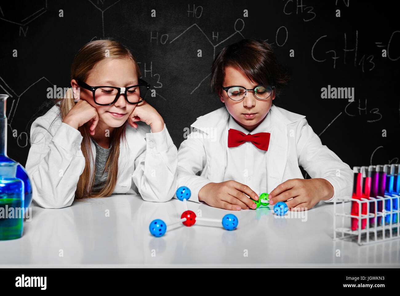 Two colleagues from school thinking about chemistry Stock Photo - Alamy