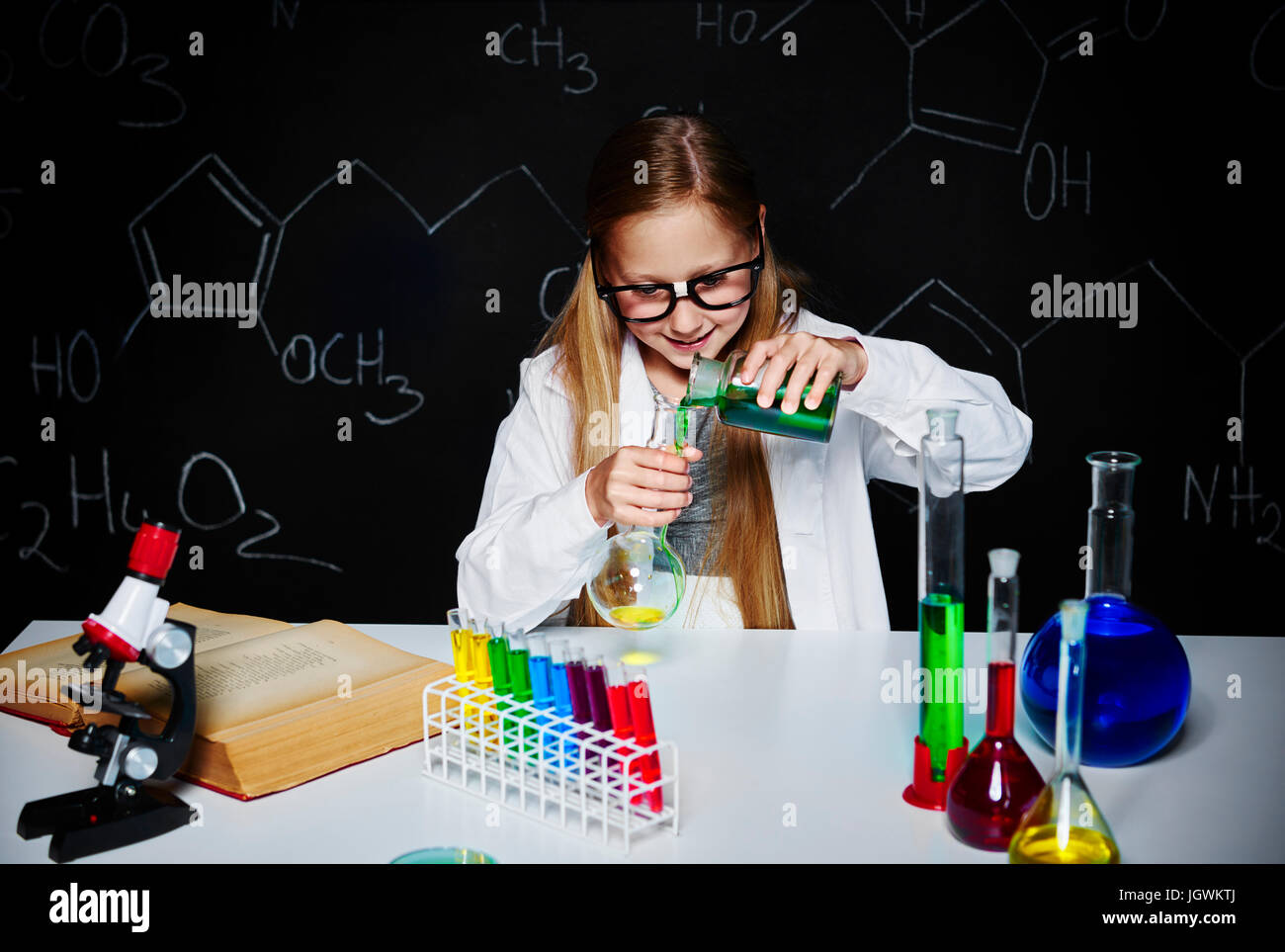 Blonde scientist make a experiment Stock Photo - Alamy