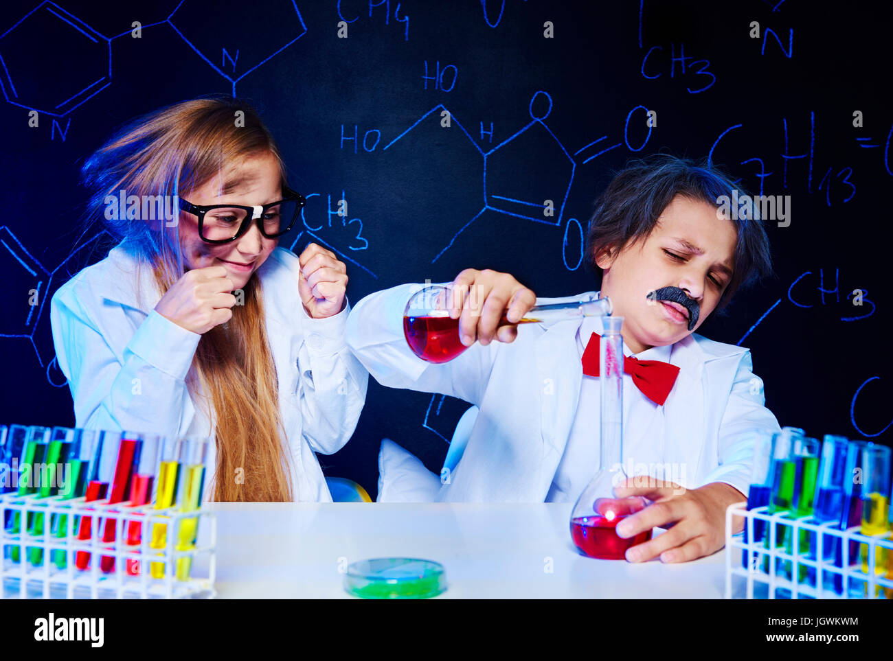 Kids waiting for effect of them experiment Stock Photo - Alamy