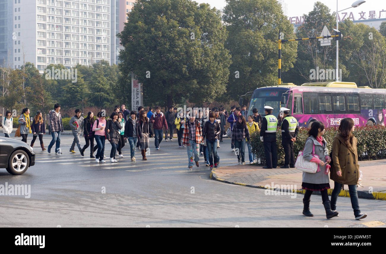 Students crossing Ren'ai Road from dormitory to university, with ...