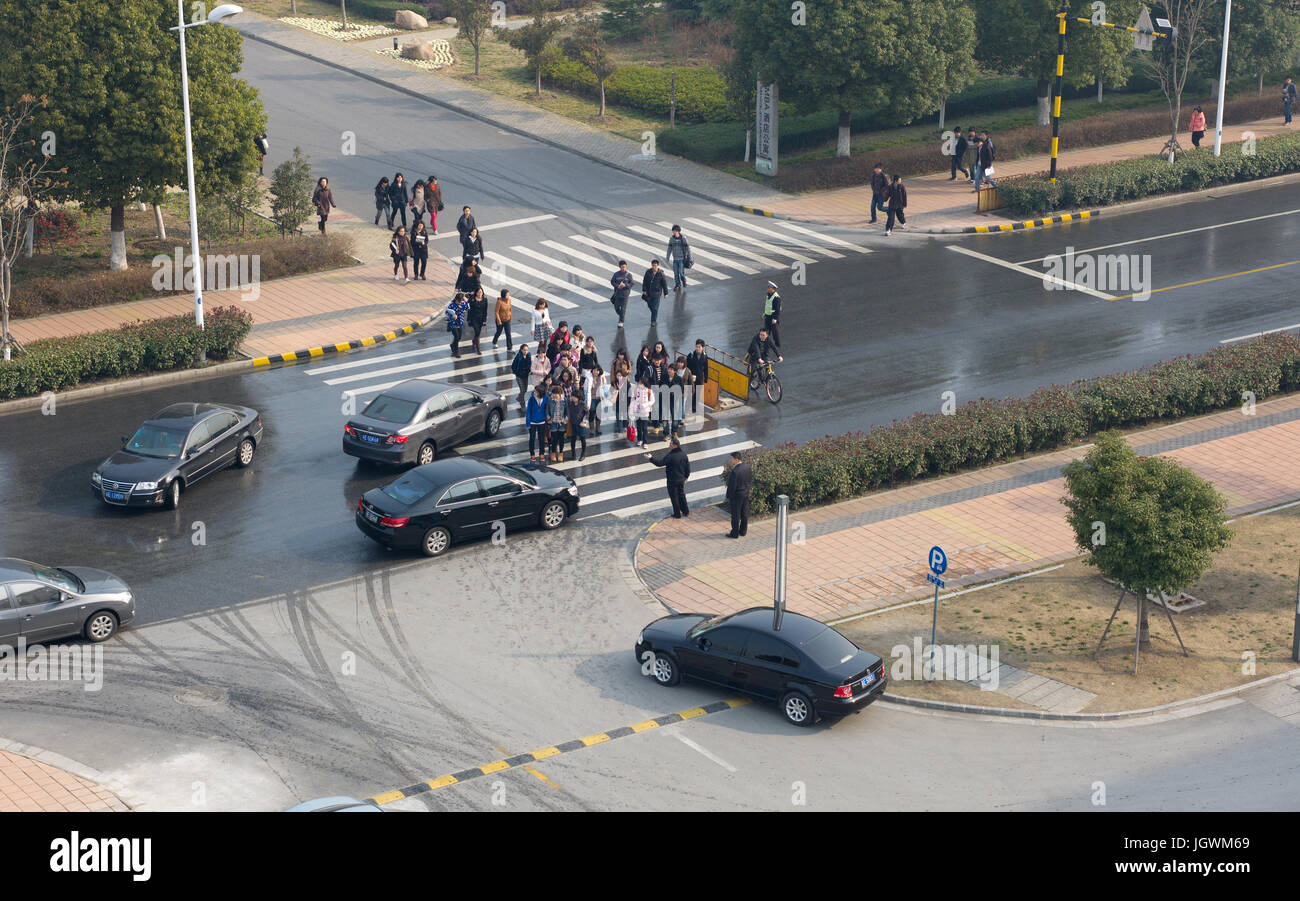 Students crossing Ren'ai Road from dormitory to university, with ...
