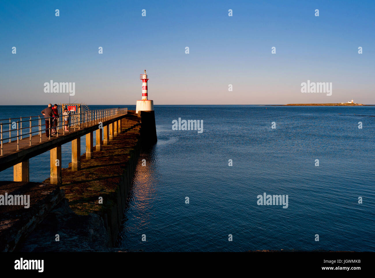 Pier and Lighthouse, Amble harbour in Northumberland Stock Photo - Alamy