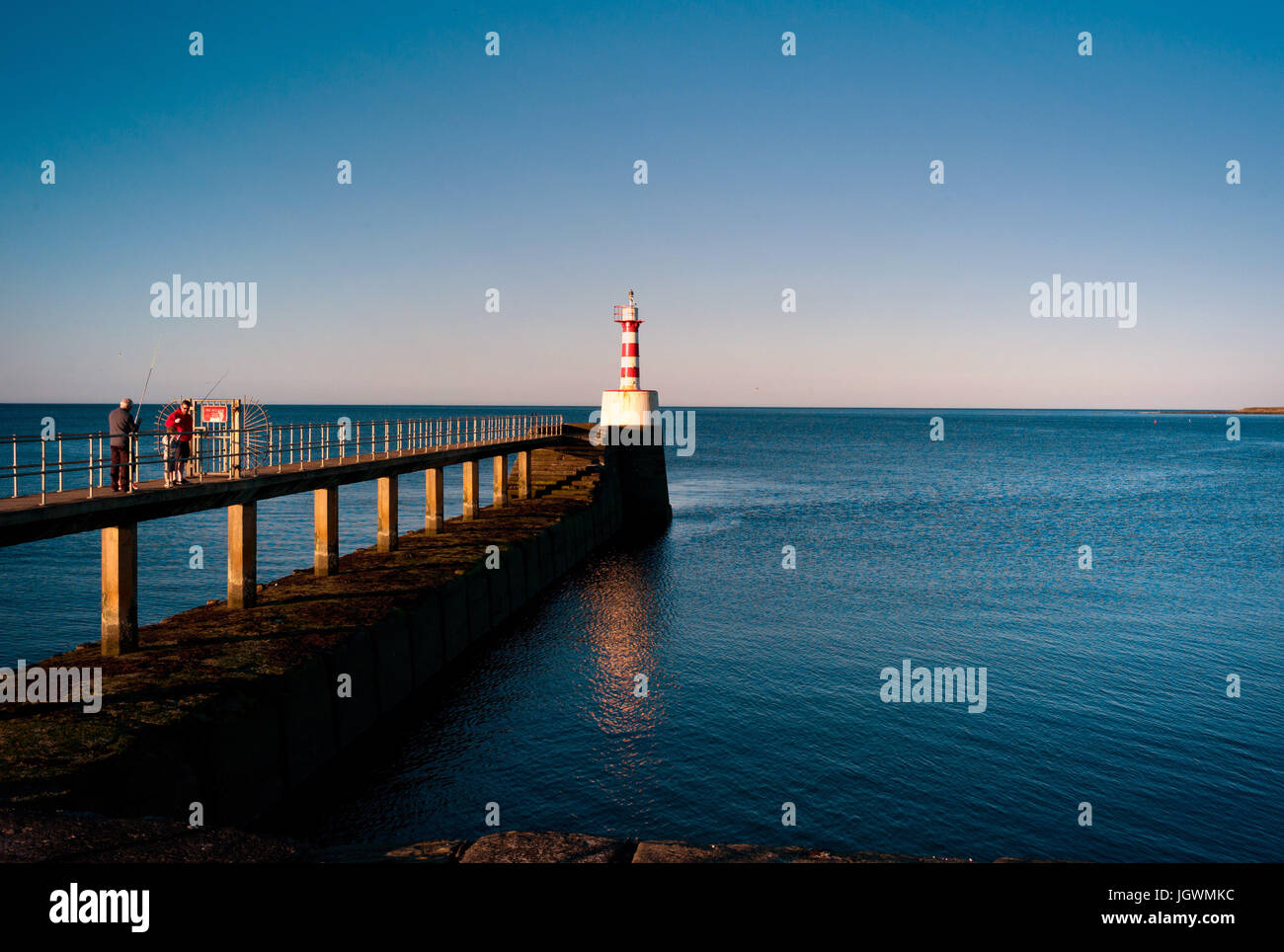 Pier and Lighthouse, Amble harbour in Northumberland Stock Photo - Alamy