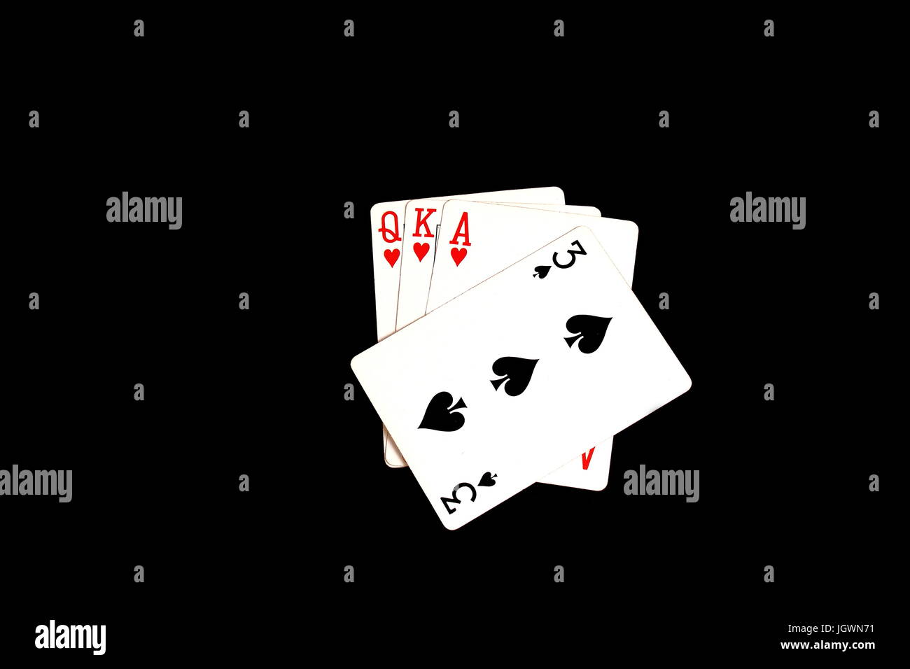 Playing cards - a trump card played - black background in landscape ...